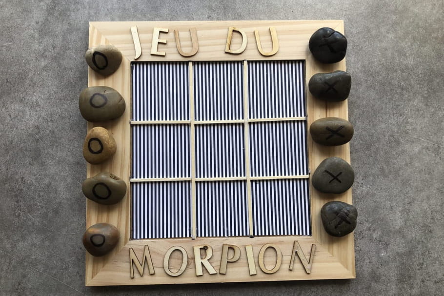 Confectionnez un morpion en galets, le jeu parfait pour les vacances